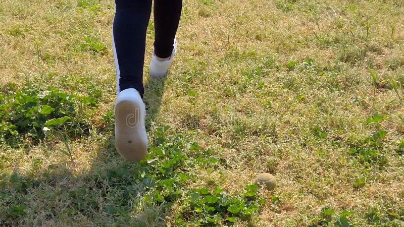 Kid Girl Running in the Meadow in Spring Slow Motion Back View Stock ...
