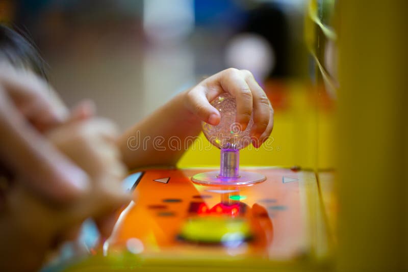 Kid Hand Controlling Arcade Doll Stock Photos - Free & Royalty-Free ...