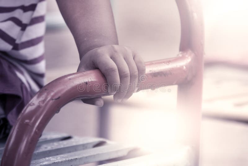 Kid Hand Holding Handlebar Steel in Playground Stock Photo - Image of ...