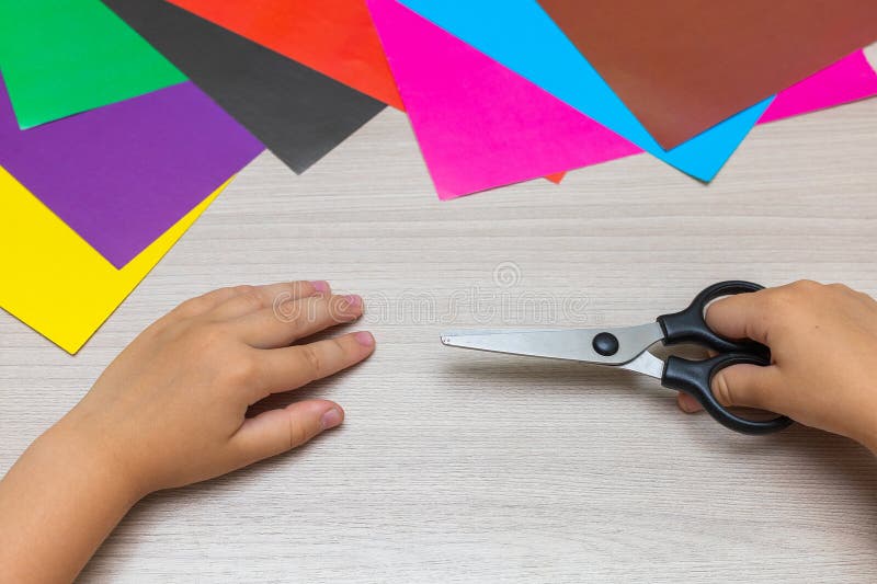Kid Hands Cutting Colored Paper with Scissors. Education, Learning ...