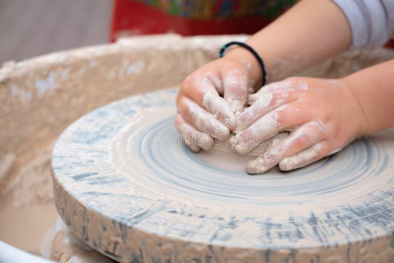 Kid Hands Forming Clay on a Pottery Wheel Stock Image - Image of ...