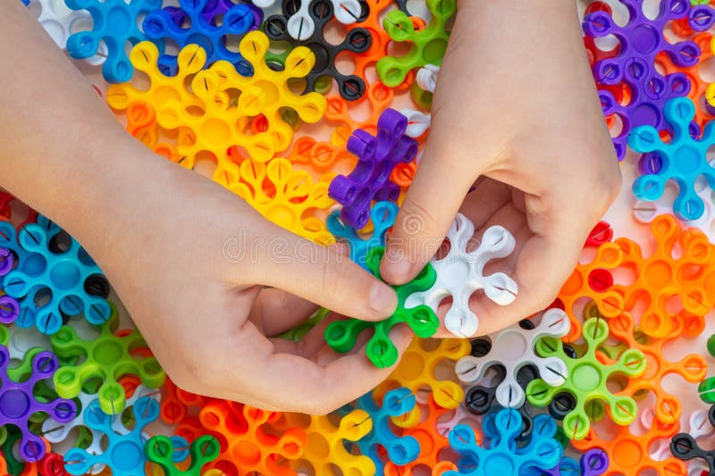 Kid Hands Playing with Colorful Connector Toy. Educational Activity ...