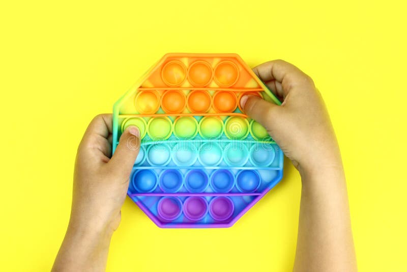 Kid Hands Playing with Colorful Pop it Stock Photo - Image of education ...