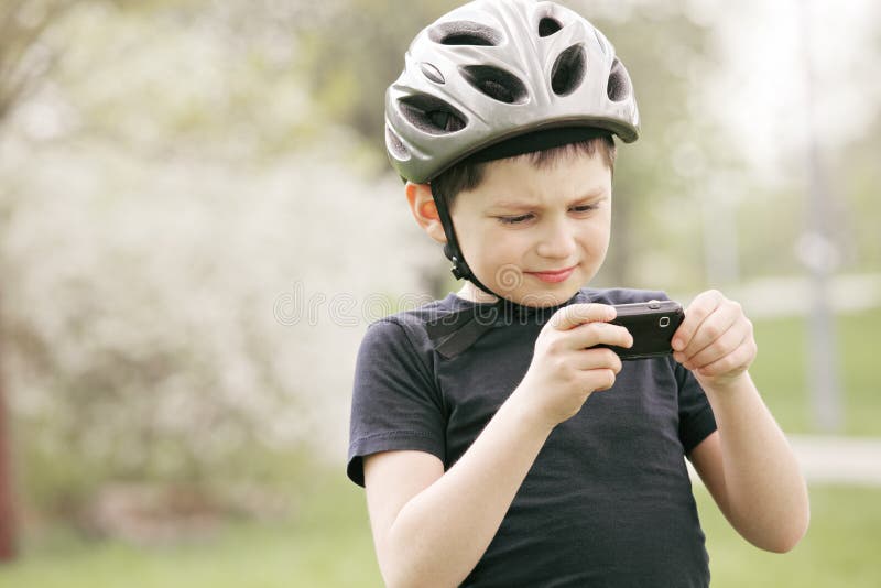 Kid in Helmet Looking at Phone Camera Stock Photo - Image of person ...
