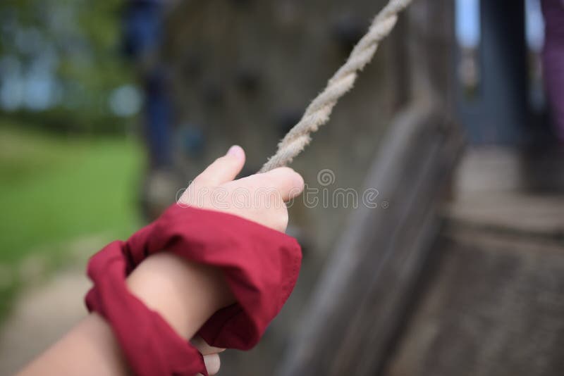 Kid Holding on To a Rope on a Playground Stock Photo - Image of park ...