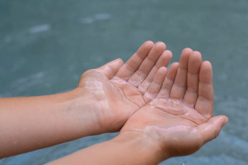 Kid Holding Water in Hands Above Sea Outdoors, Closeup Stock Photo ...