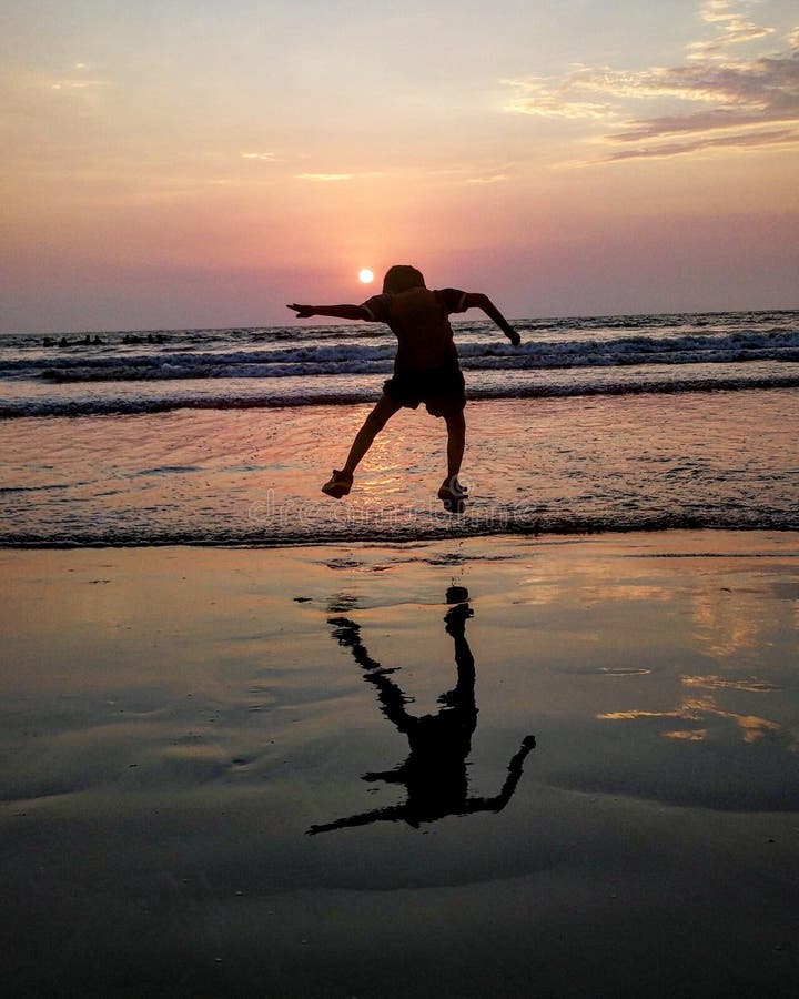 Kid jumping stock image. Image of sunset, jumping, juhu - 71191451