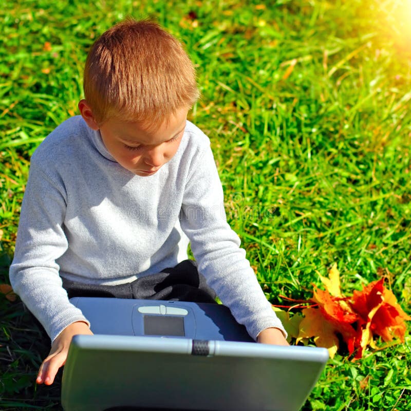 Serious Kid with Laptop stock image. Image of schoolboy - 37897605