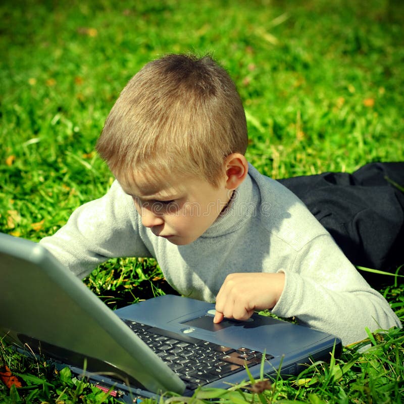 Serious Kid with Laptop stock image. Image of schoolboy - 37897605