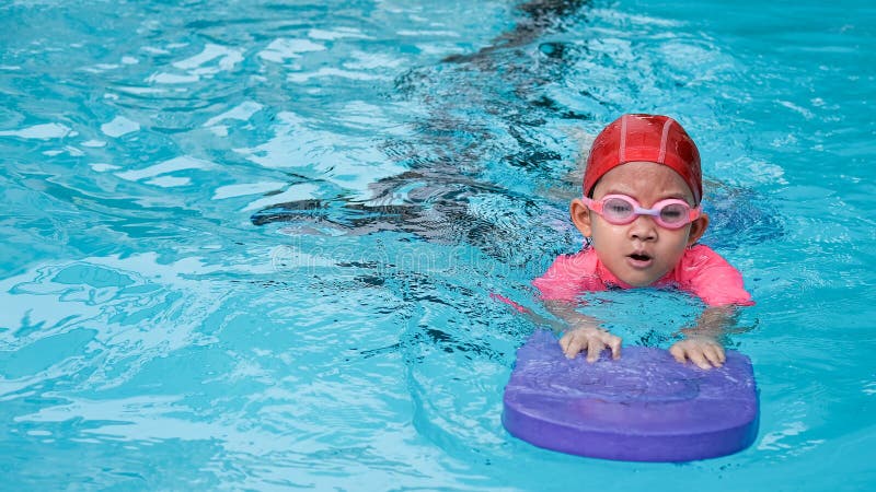 Kids Learn How To Swim in Swimming Class Stock Image - Image of motion ...