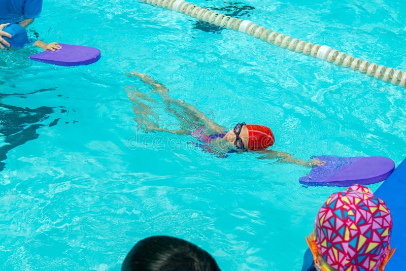 Kid Learn How To Swim in Swimming Class Stock Photo - Image of girl ...
