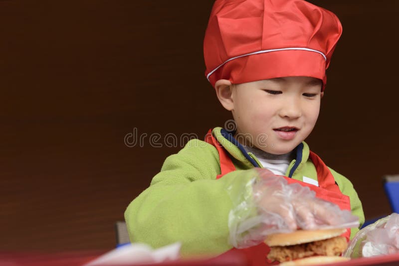 Kid making hamburger stock image. Image of hamburger - 70603633