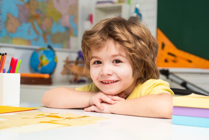 Kid is Learning in Class on Background of Blackboard. Learning and ...