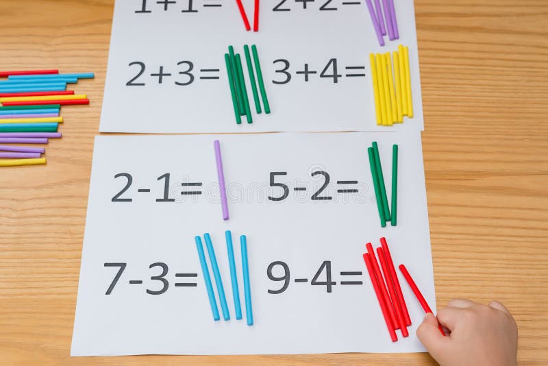 Kid Learning Simple Subtraction and Addition by Counting Sticks Stock ...