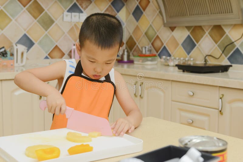 Kid learning to cook stock image. Image of child, chinese - 77255153