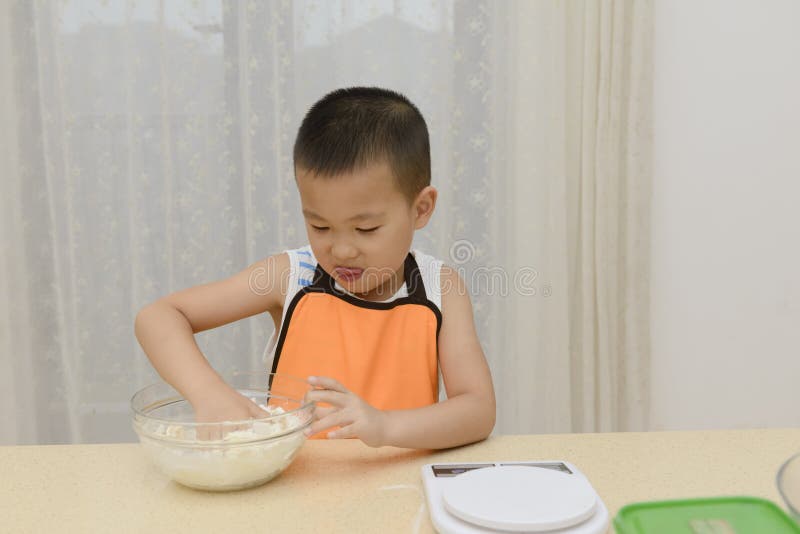 Kid learning to cook stock image. Image of child, chinese - 77255153