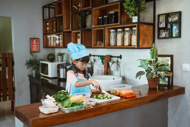 Kid Learning To Cook at Home Stock Image - Image of girl, apron: 182935129