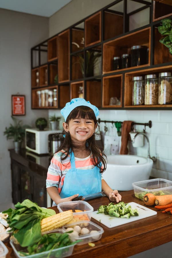 Kid Learning To Cook at Home Stock Image - Image of girl, child: 182936233