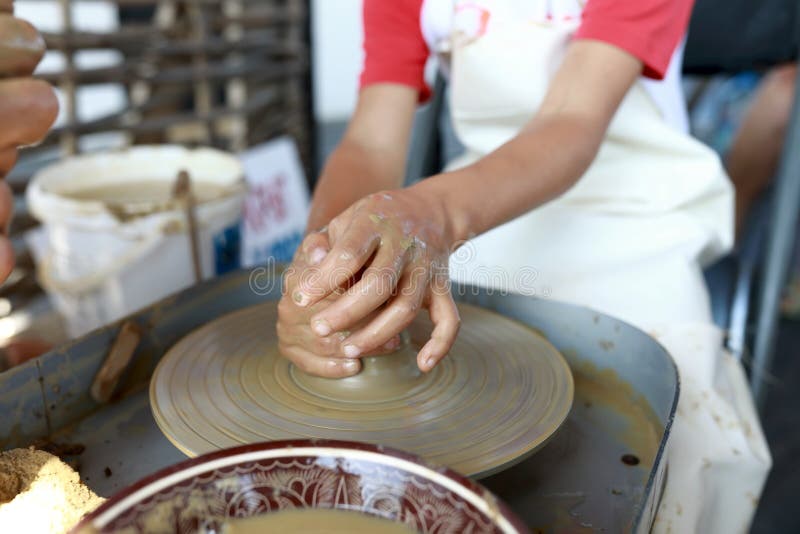 Kid works on pottery wheel stock photo. Image of craft - 160995884