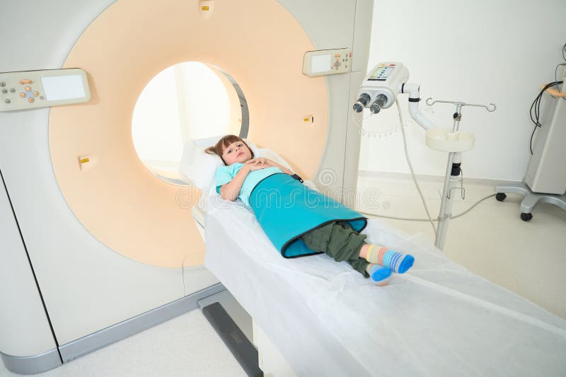 Kid Lying on the Mobile Surface of the CT Machine Stock Photo - Image ...