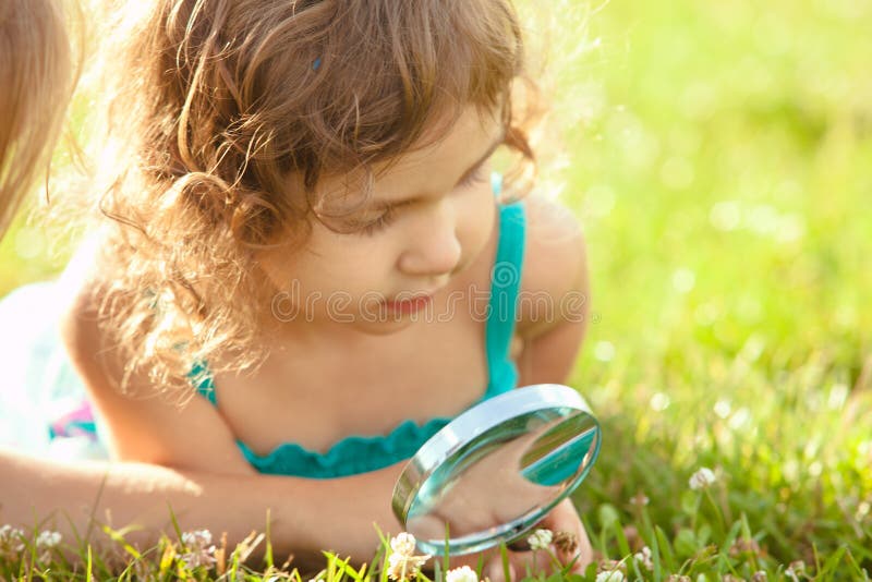 Kid with magnifying glass stock image. Image of curious - 54882379