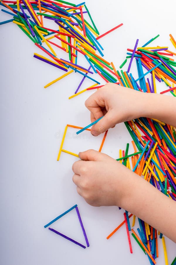 Kid Making Geometric Shapes with Colorful Sticks on White Background ...