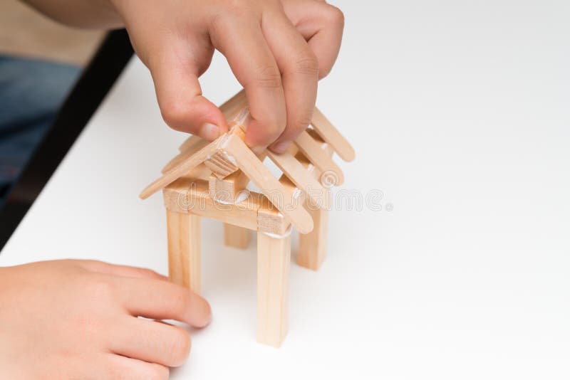 Kid making a house model stock image. Image of property - 97725517