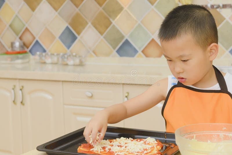 Kid making pizza stock image. Image of food, focused - 77254945