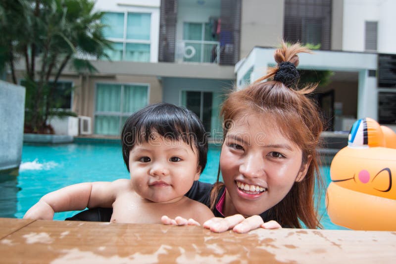 The Kid and Mom Play Together in the Pool Stock Photo - Image of baby ...
