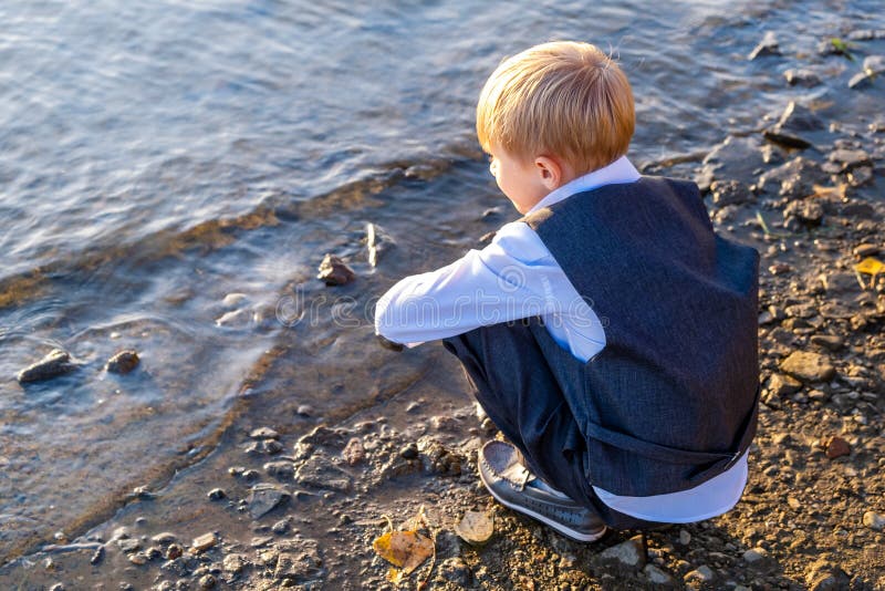 Kid near the water stock image. Image of childhood, investigate - 210478459