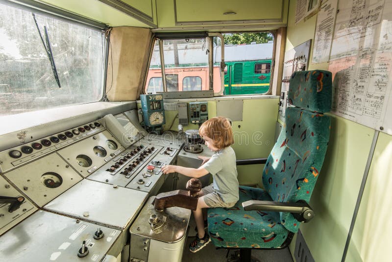 Kid in old train driving stock photo. Image of history - 223431808