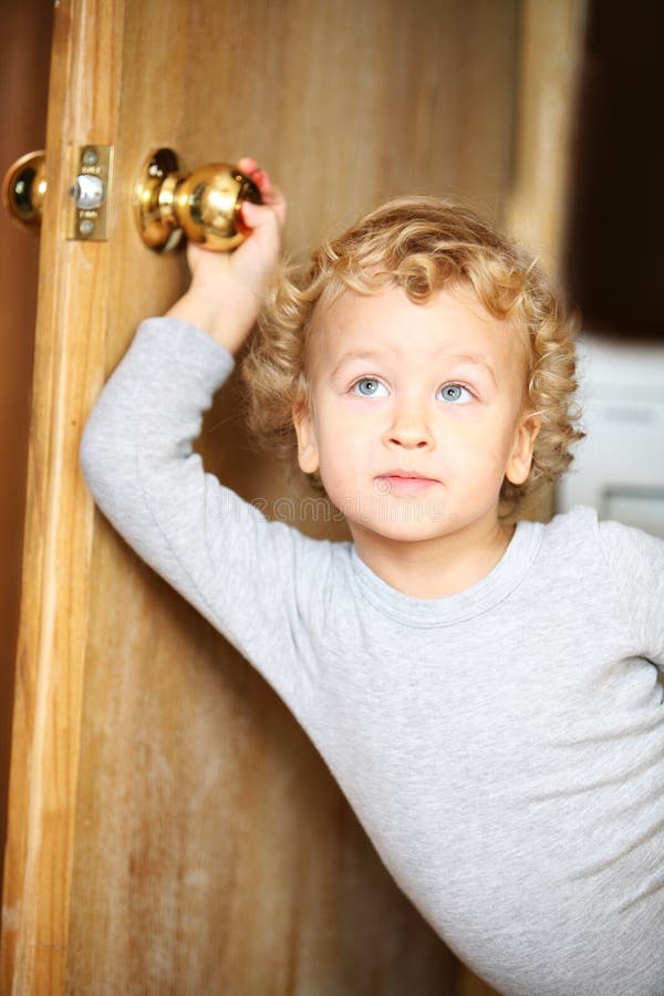 Kid opened a door. stock image. Image of home, open, childhood - 8057467