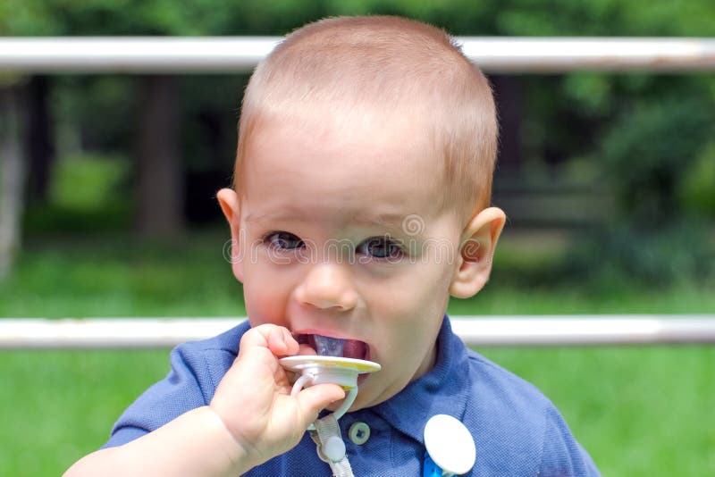 Kid with pacifier stock photo. Image of pacifier, young - 26904326