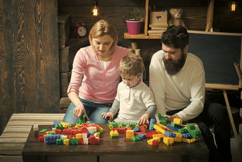 Kid with Parents Play with Plastic Blocks, Build Construction ...