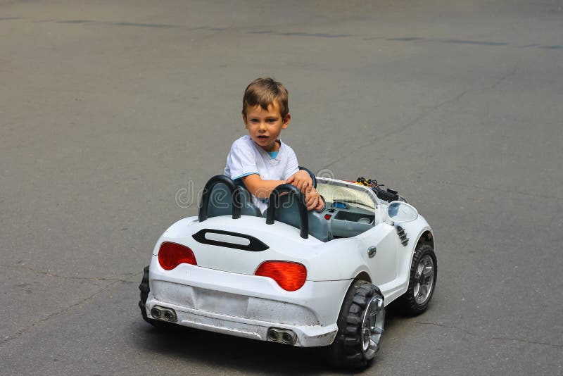 Kid in the Park Riding a Toy Car Stock Image - Image of casual, game ...
