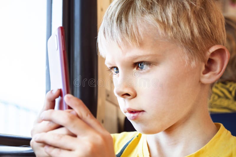 Kid with a Phone stock image. Image of looking, child - 254496297