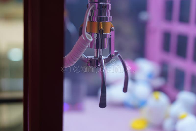 Kid Play Claw Game in Asia Arcade for Happiness and Fun. Stock Image ...