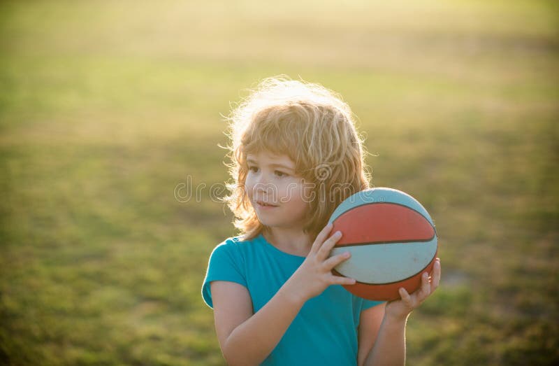 Kid Playing Basketball with Basketball Ball Outdoor. Stock Photo ...