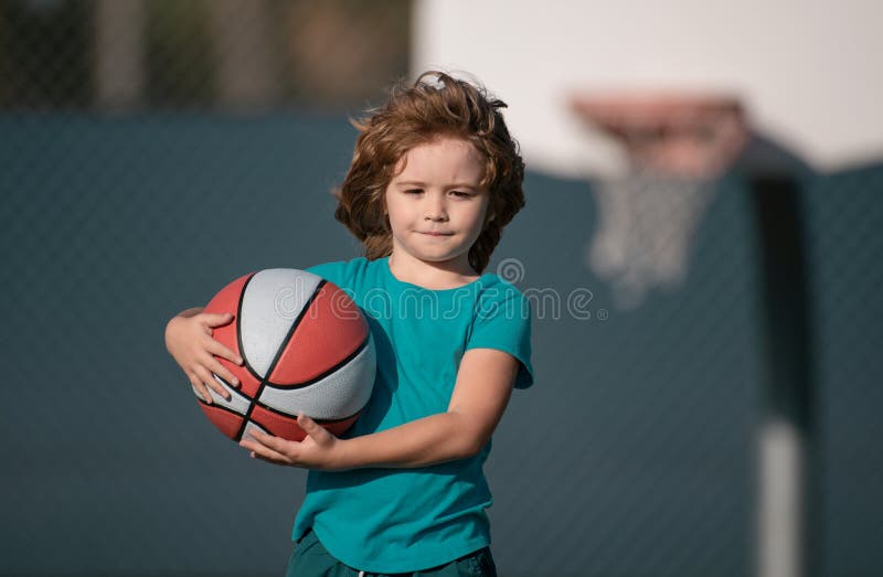 Kid Playing Basketball with Basket Ball. Kid Posing with a Basketball ...