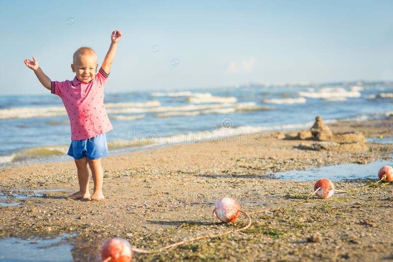 Kid playing on beach stock photo. Image of racket, shore - 76355006