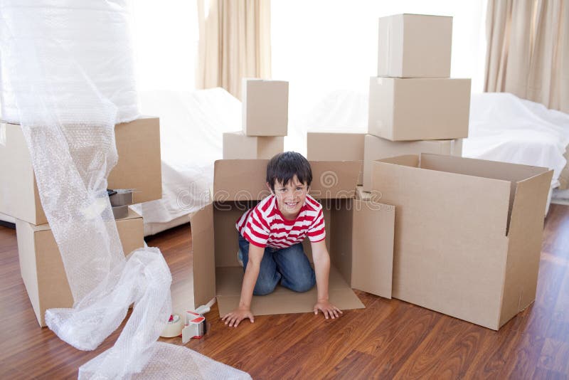 Kid Playing with Boxes in New House Stock Photo - Image of child ...
