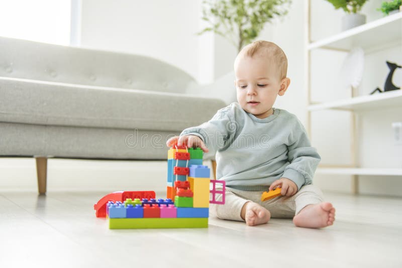 Kid Playing with Colorful Toy Blocks at Home. Stock Photo - Image of ... Kid Playing with Colorful Toy Blocks at Home. Stock Photo - Image of ...