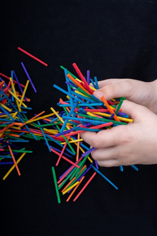 Kid Playing with Coloured Wooden Sticks for Creativity Stock Image ...