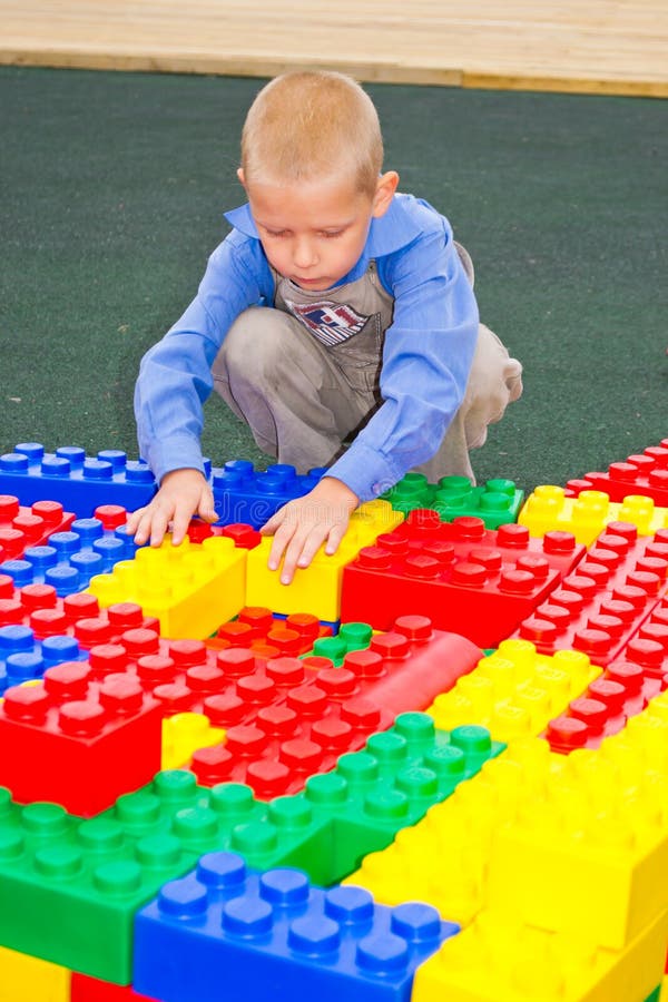 Kid playing with cubes stock image. Image of builder - 41664475