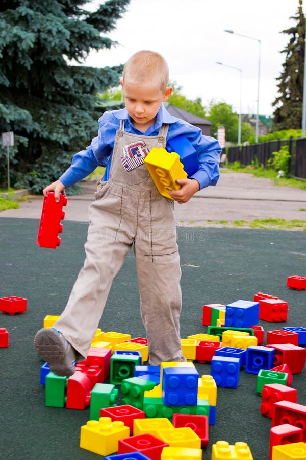 Kid playing with cubes stock image. Image of education - 41664411