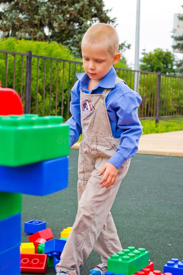 Kid playing with cubes stock image. Image of color, estate - 41664483