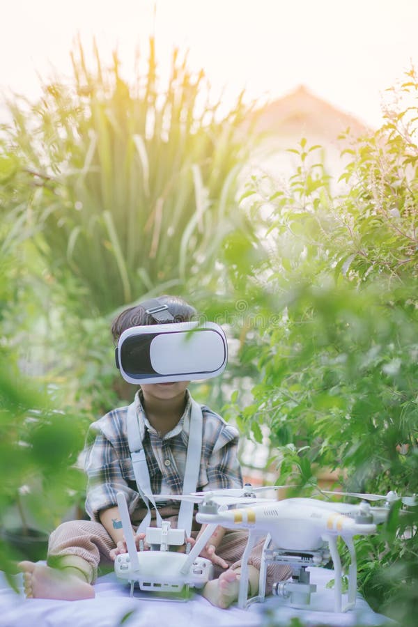Kid Playing Drone. Little Pilot Using Drone Remote Controller. Young ...