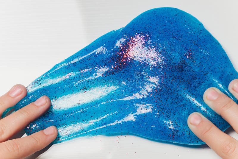 Kid Playing Hand Made Toy Called Slime Alien Drool Shell Mussel. Stock ...