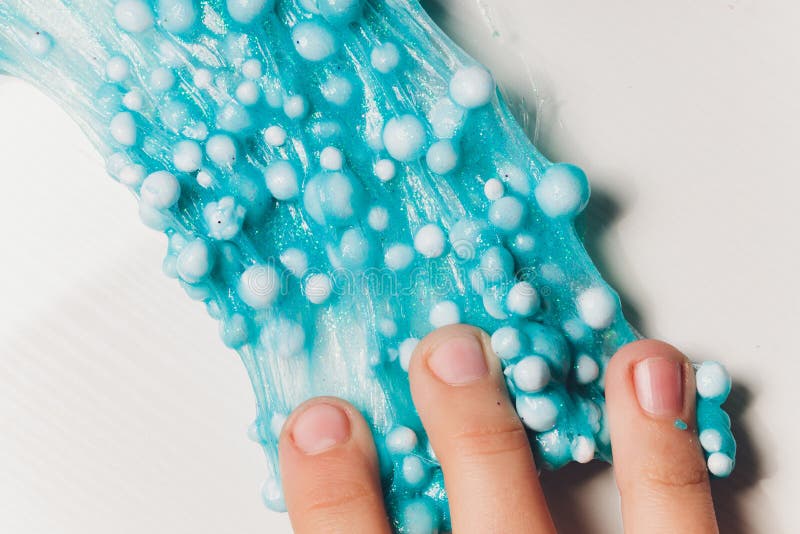 Kid Playing Hand Made Toy Called Slime Alien Drool Shell Mussel. Stock ...