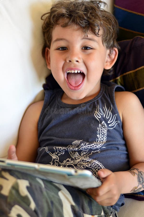 Kid playing with i-pad stock photo. Image of indoor, leisure - 39975564